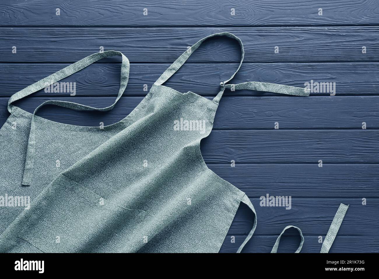 Color apron with pattern on grey wooden table, top view Stock Photo - Alamy