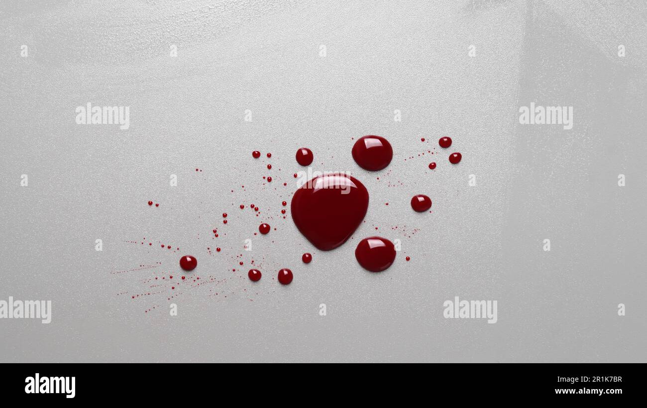 Drops of blood on grey background, top view Stock Photo - Alamy