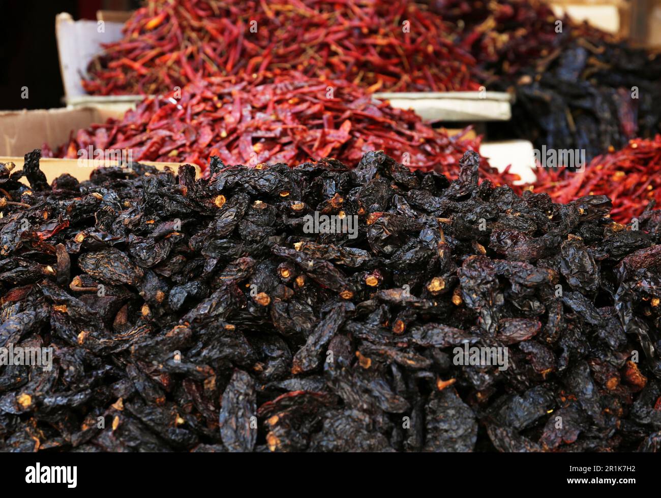 Heap of dried Ancho chile peppers on counter at market Stock Photo - Alamy