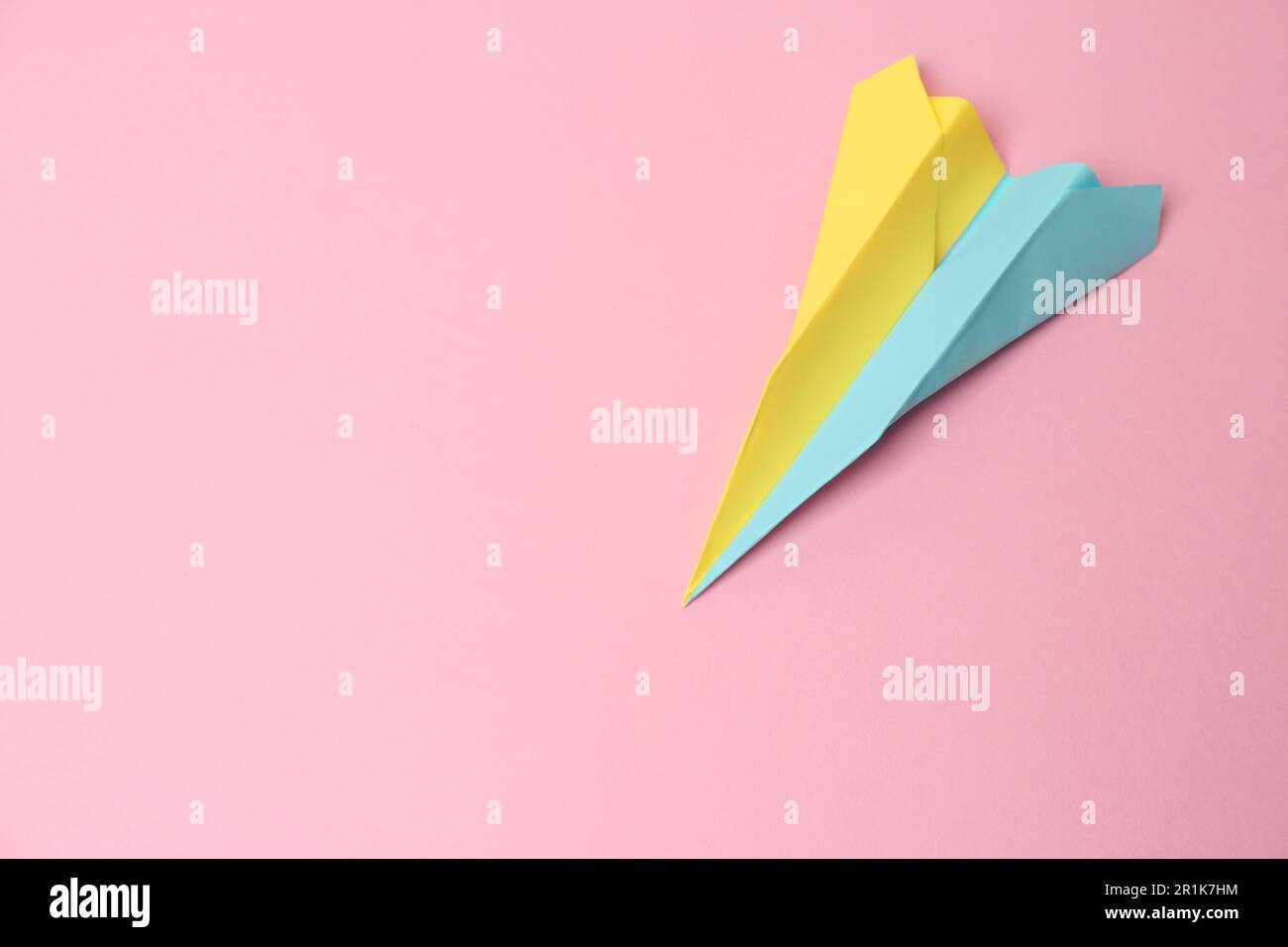 Colorful paper plane on pink background, top view. Space for text Stock ...