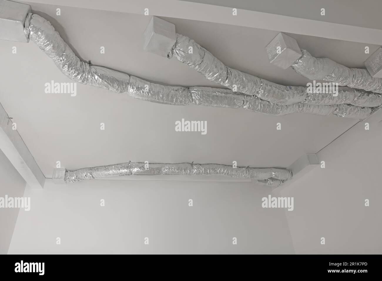 Ceiling with modern ventilation system in renovated room Stock Photo ...