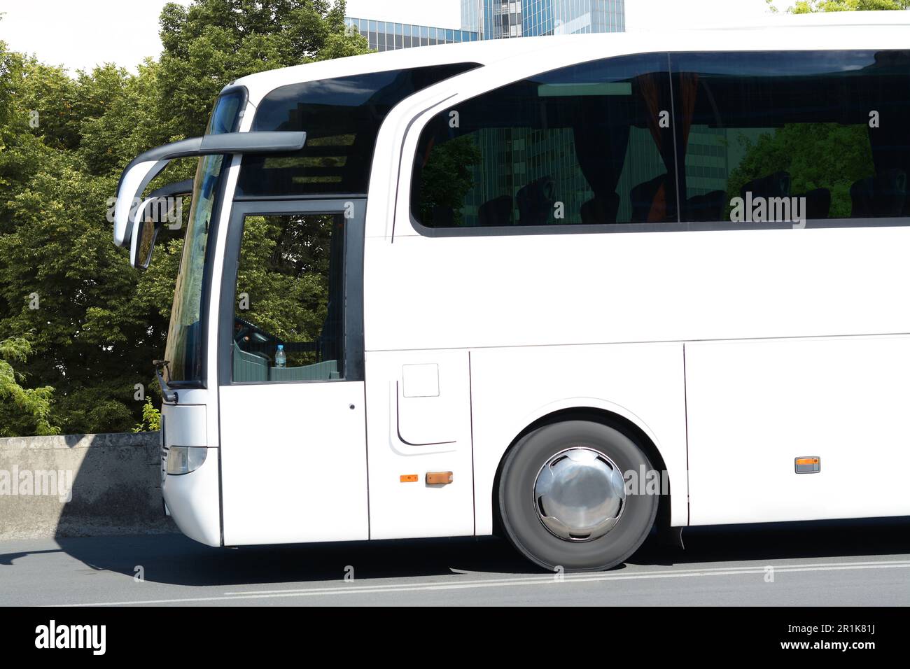 Modern white bus on road outdoors. Public transport Stock Photo - Alamy