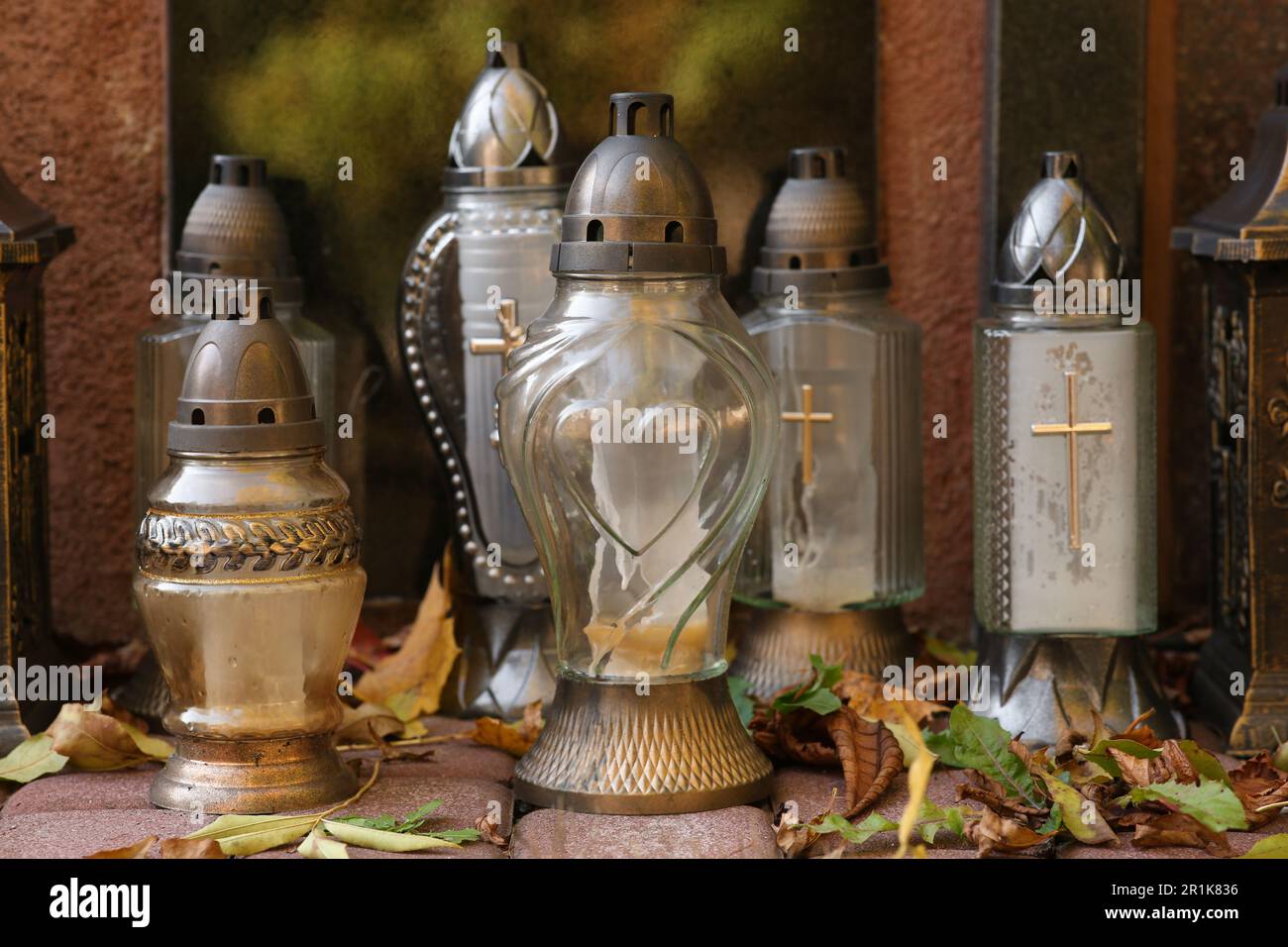 Grave lanterns on stone surface in cemetery Stock Photo - Alamy