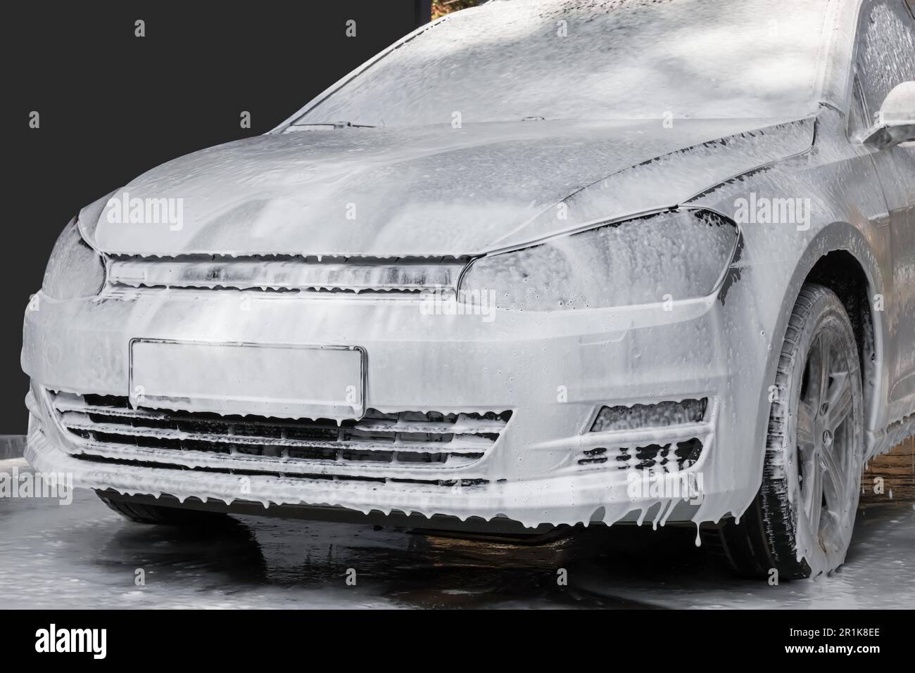 Auto with cleaning foam at outdoor car wash Stock Photo - Alamy