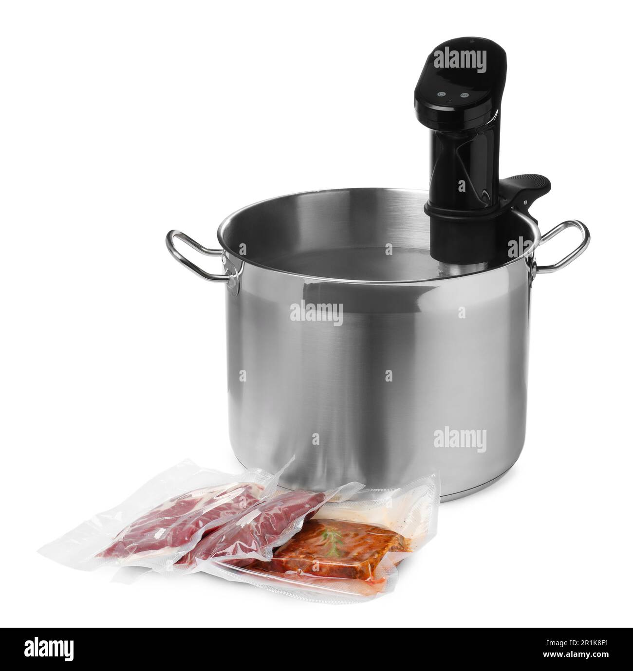 Thermal immersion circulator in pot and meat on white background ...