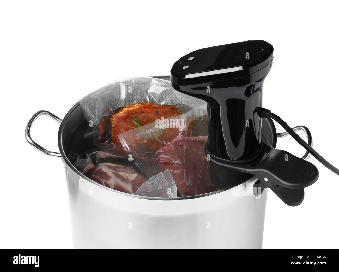 Thermal immersion circulator and meat in pot on white background ...