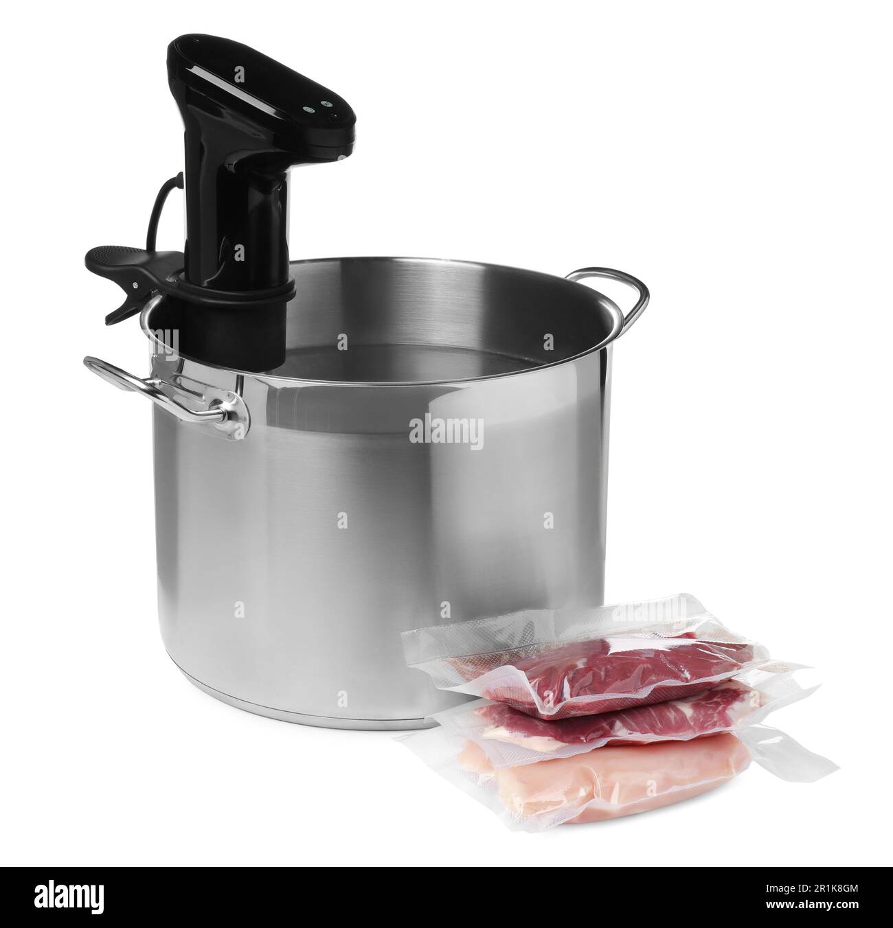 Thermal immersion circulator in pot and meat on white background ...