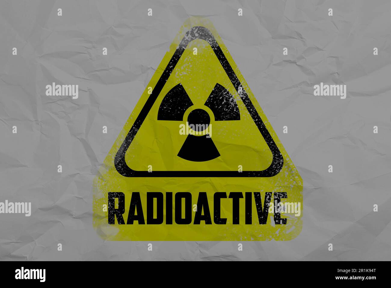Radioactive sign on crumpled white paper. Hazard symbol Stock Photo - Alamy