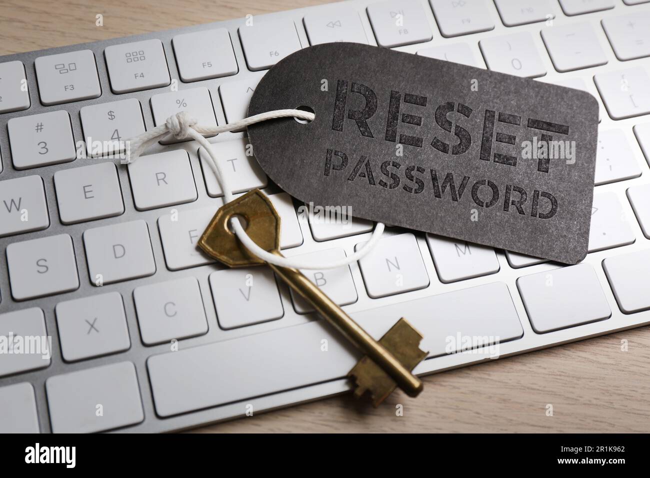 Key with tag RESET PASSWORD on keyboard, closeup Stock Photo - Alamy