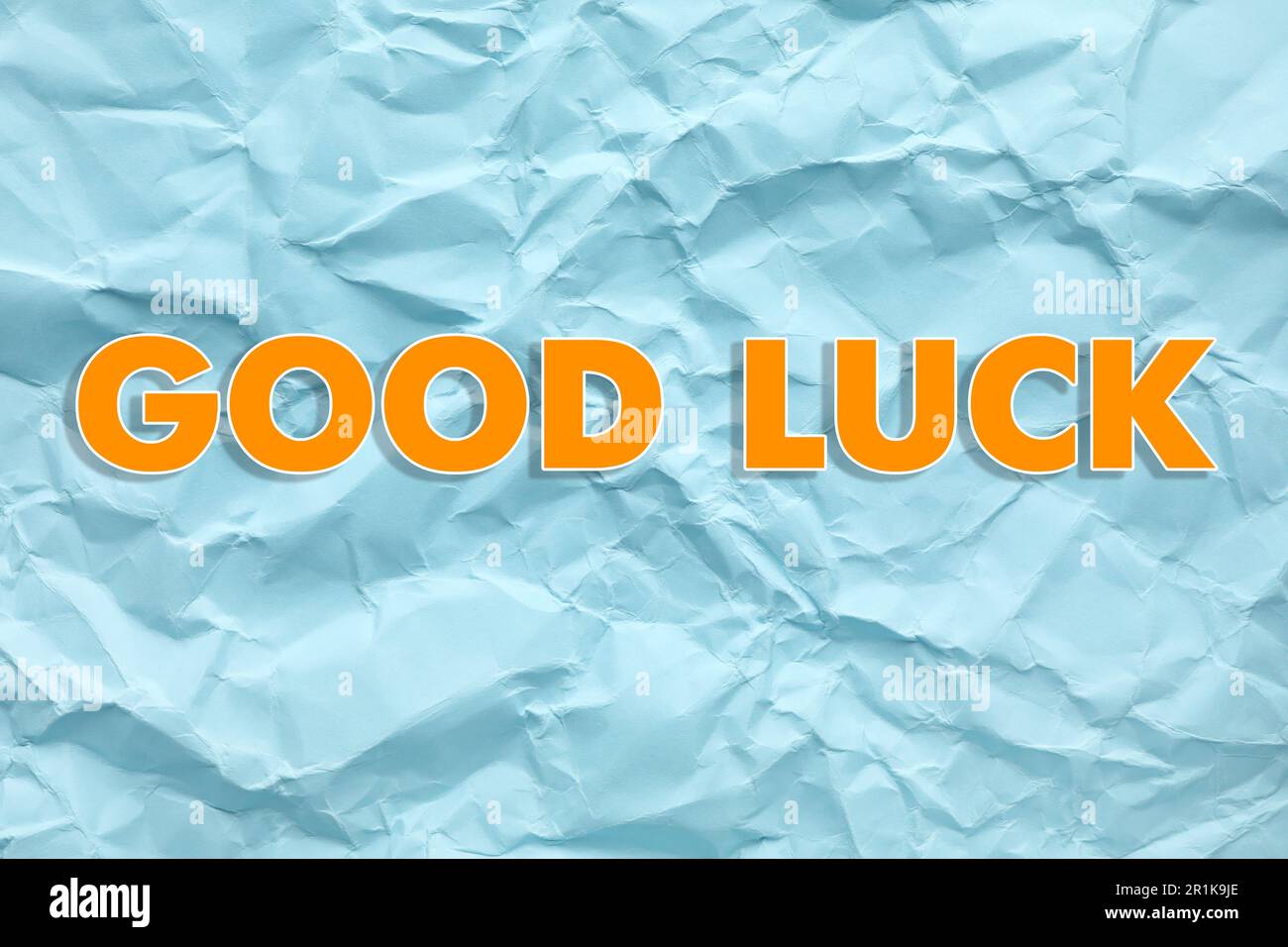Phrase GOOD LUCK on light blue crumpled paper, top view Stock Photo - Alamy