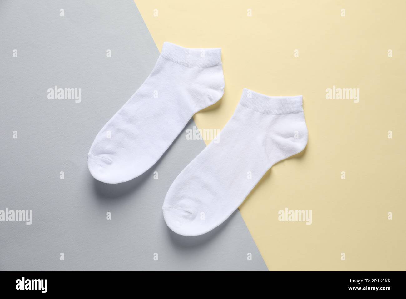 Pair of white socks on colorful background, flat lay Stock Photo - Alamy