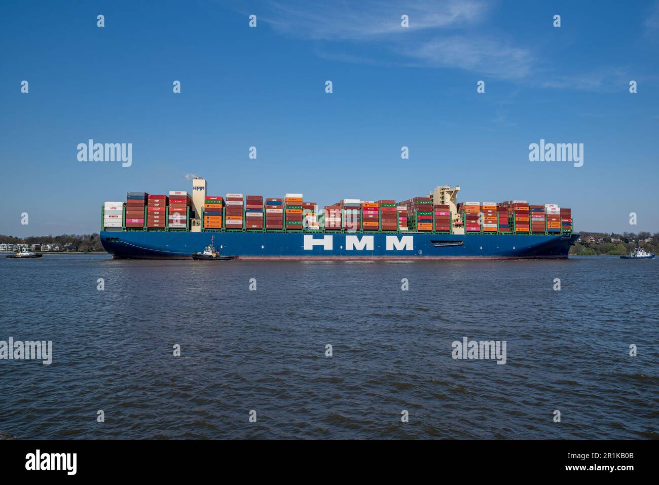 Hamburg, Germany - 04 17 2023: A container ship of the shipping company HMM on the Elbe in ...