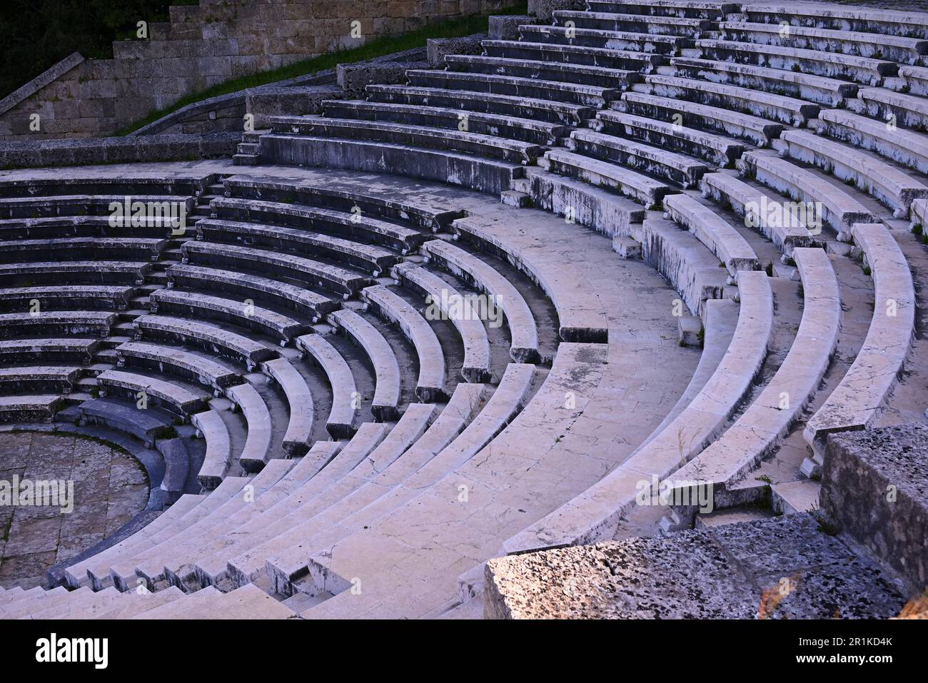 Ancient Greek theater-odeon with stone rows and steps between the rows ...