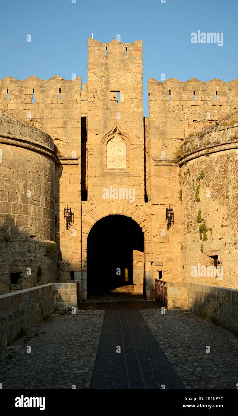 Entrance gate to the medieval city of Rhodes and a stone bridge leading ...