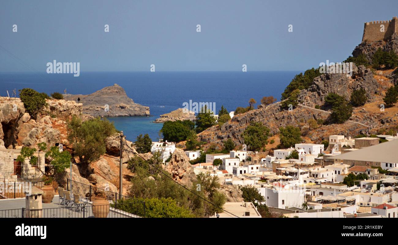 Panorama of the Greek village of Lindos with white houses and green ...