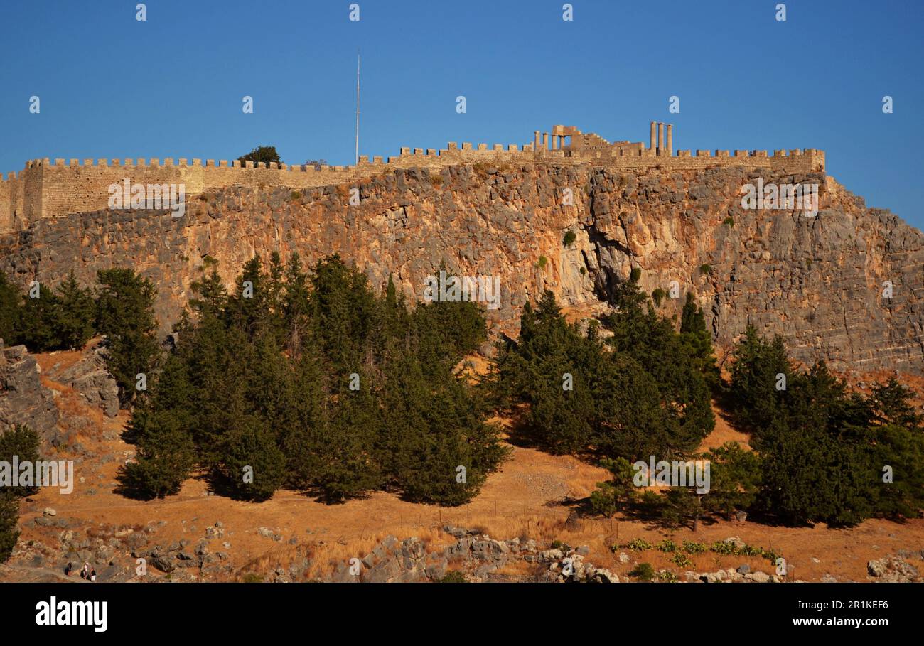 The ancient Acropolis of the goddess Athena in the village of Lindos on ...