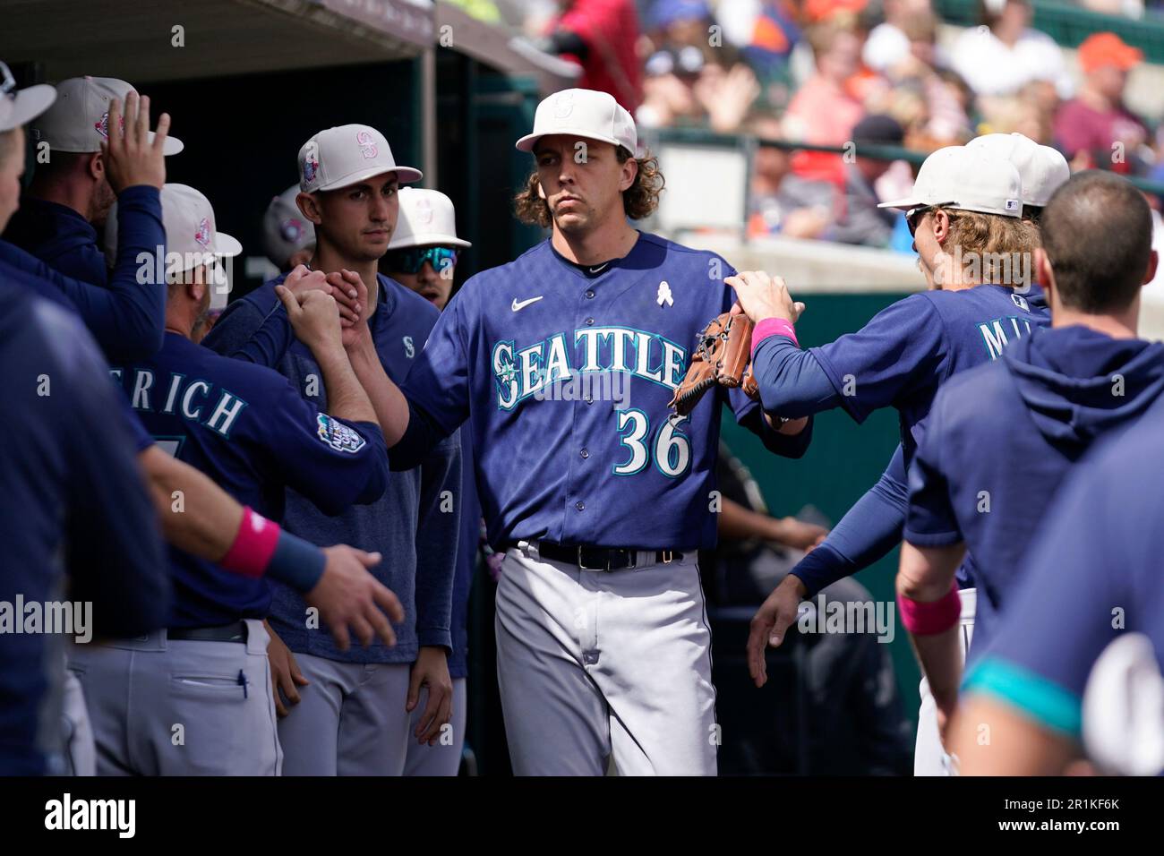 Seattle Mariners pitcher Logan Gilbert walks in the dugout after being ...