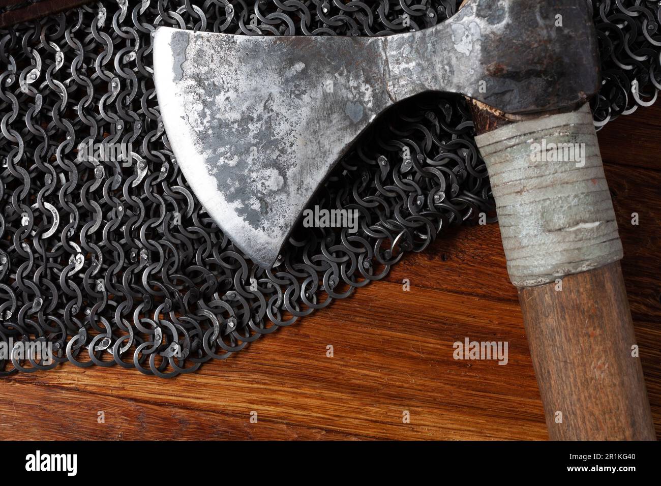 Medieval battle axe on chain mail armor background Stock Photo - Alamy