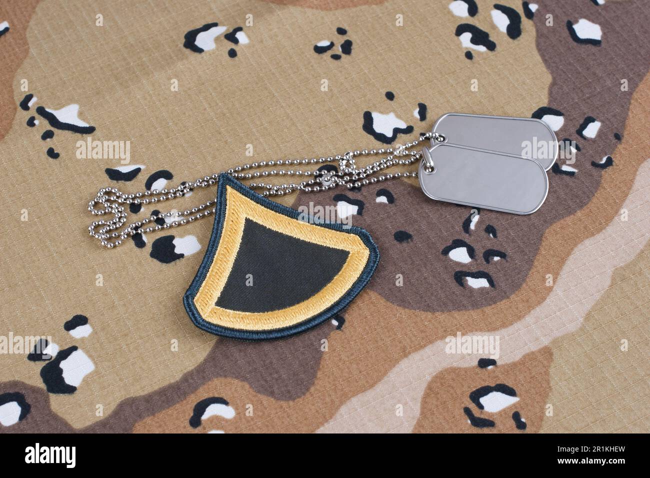 US ARMY Private First Class rank patch and dog tags on desert ...