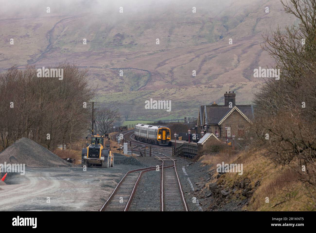 Viewed from the quarry freight sidings a Northern Rail class 158 DMU ...