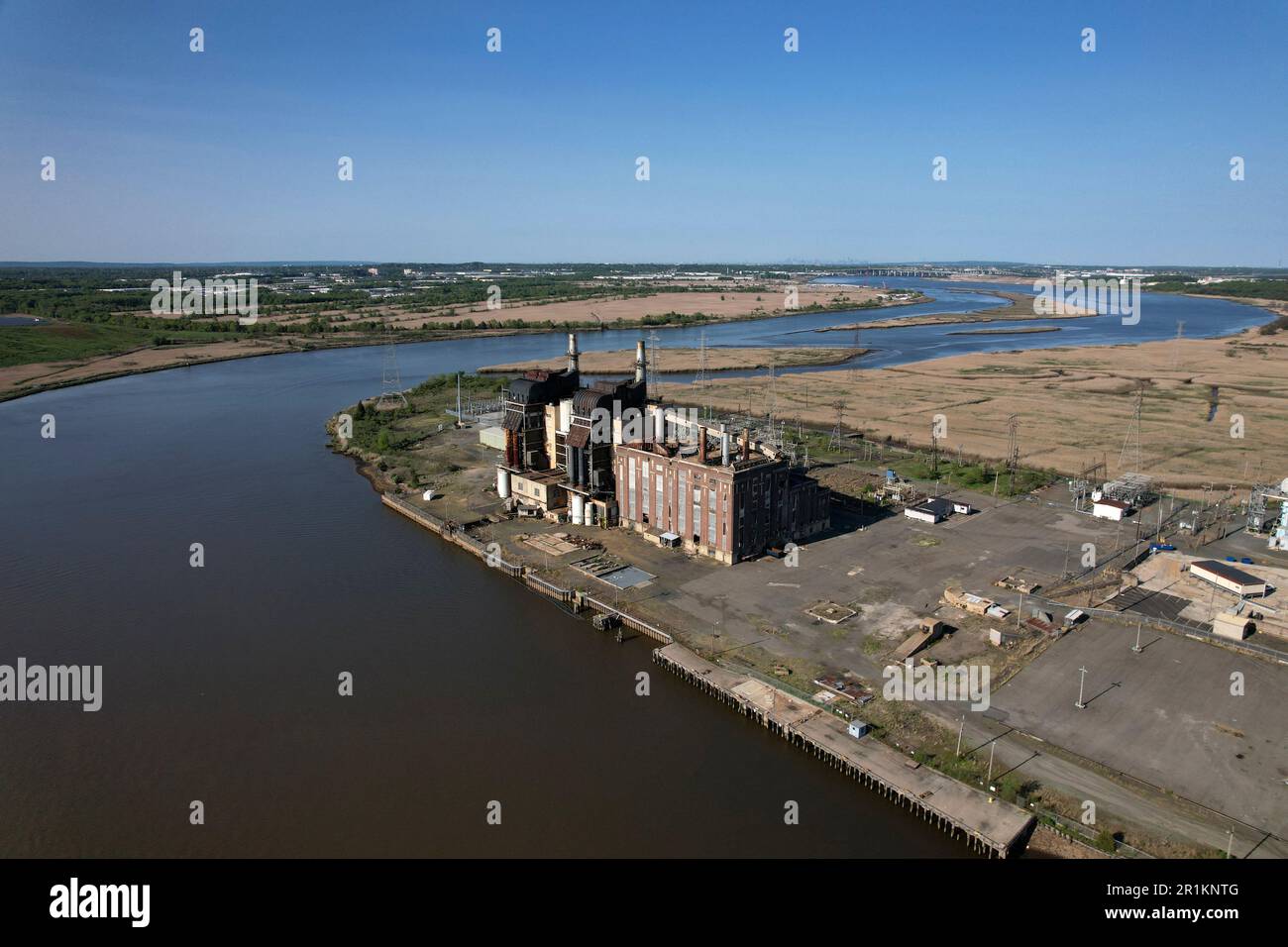 Aerial view of old coal power plant on a bend in the Raritan River in ...