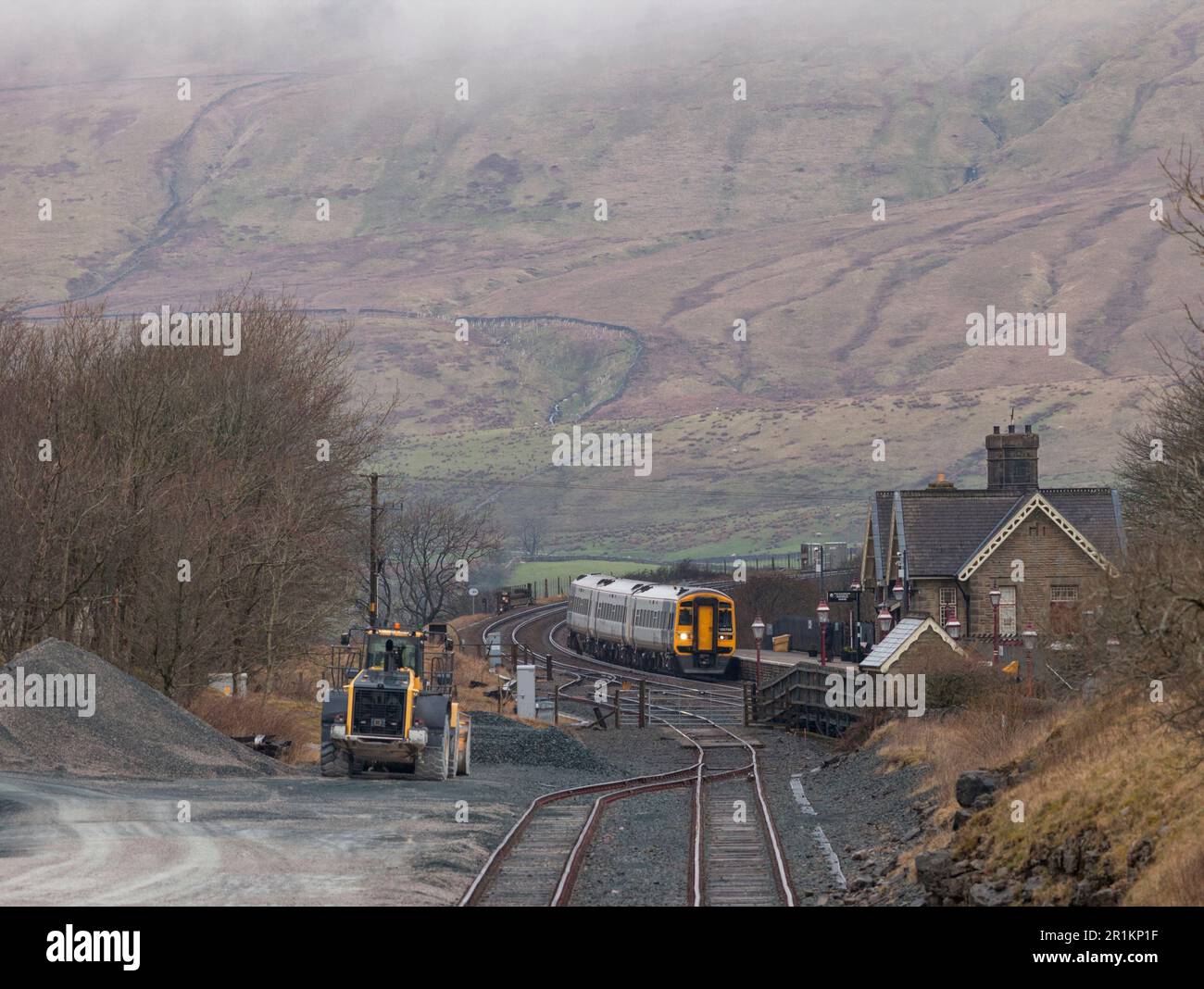 Viewed from the quarry freight sidings a Northern Rail class 158 DMU ...
