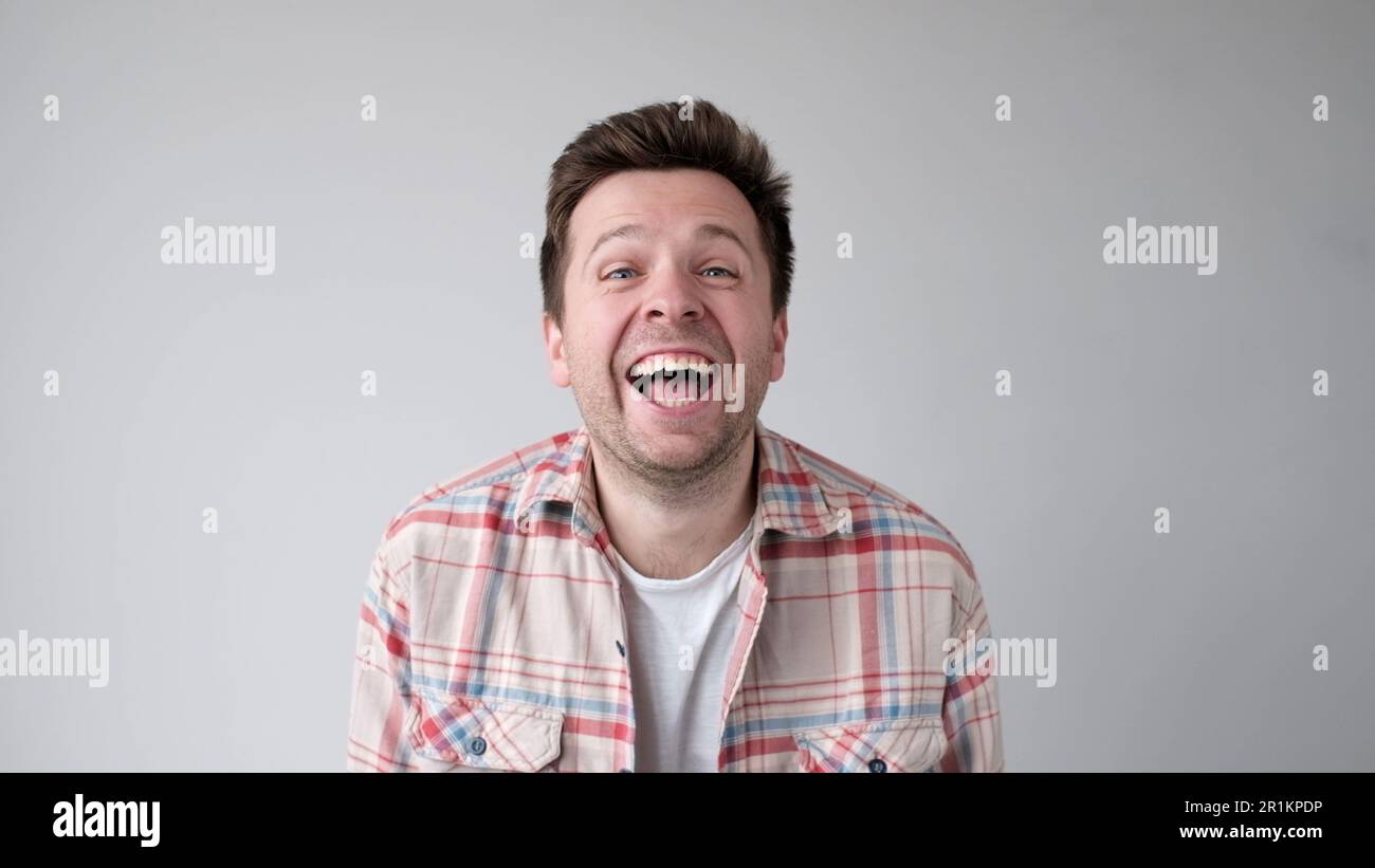 European funny young man is laughing loudly. Positive emotion Stock ...