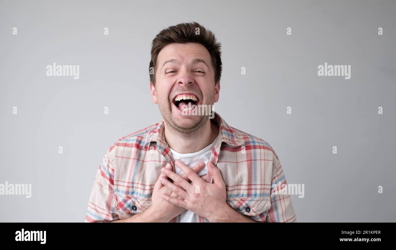 European funny young man is laughing loudly. Positive emotion Stock ...