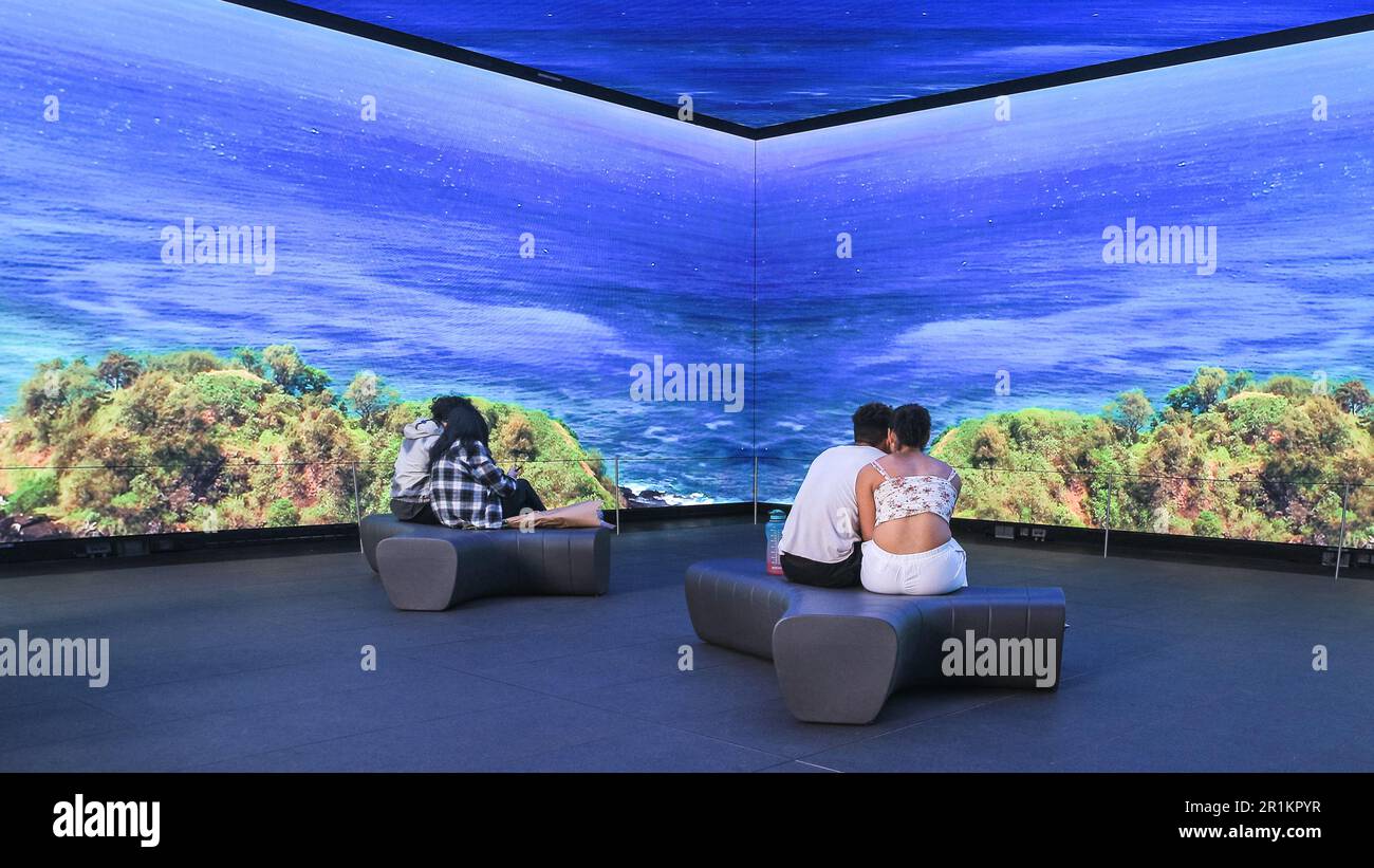 London, UK. 14th May, 2023. People watch an immersive video screen ...