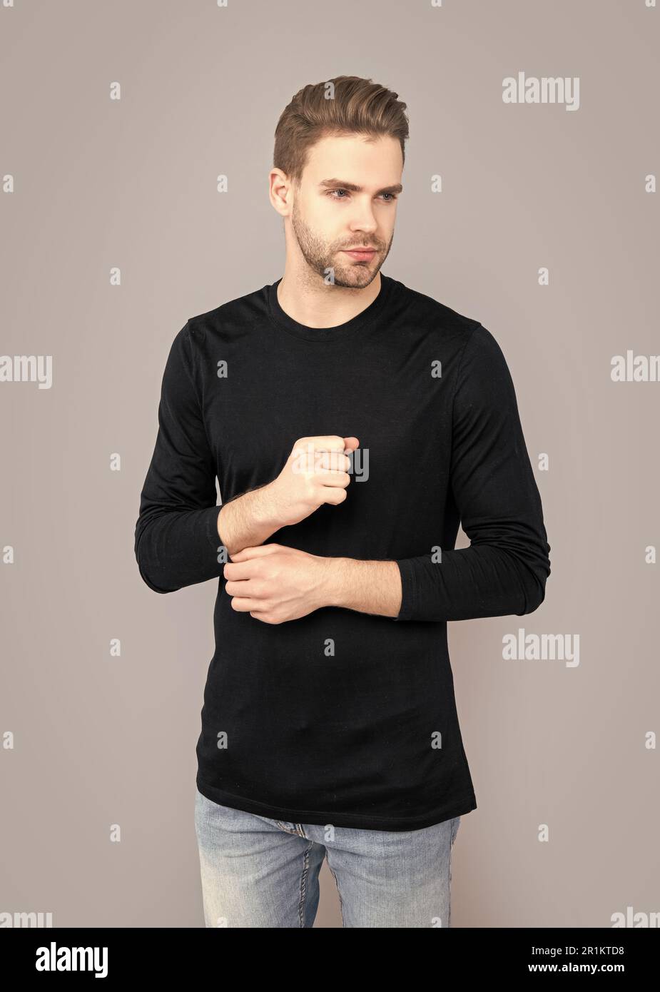 young guy with stubble isolated on grey background. caucasian guy ...