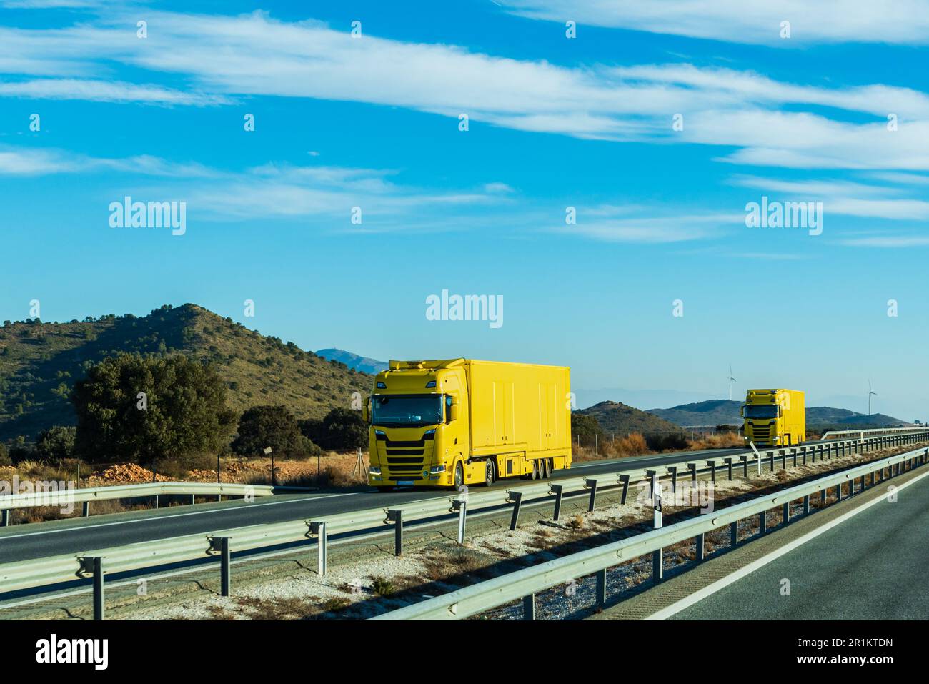 Two trucks on highway hi-res stock photography and images - Alamy
