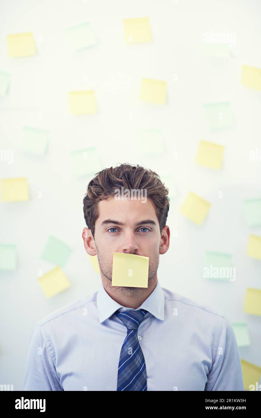 Its all sticky notes and no verbal communication. a young businessman ...
