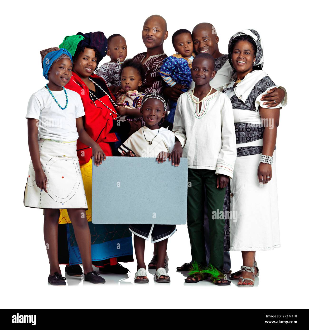 Weve got this. Studio shot of a large african family holding a blank ...