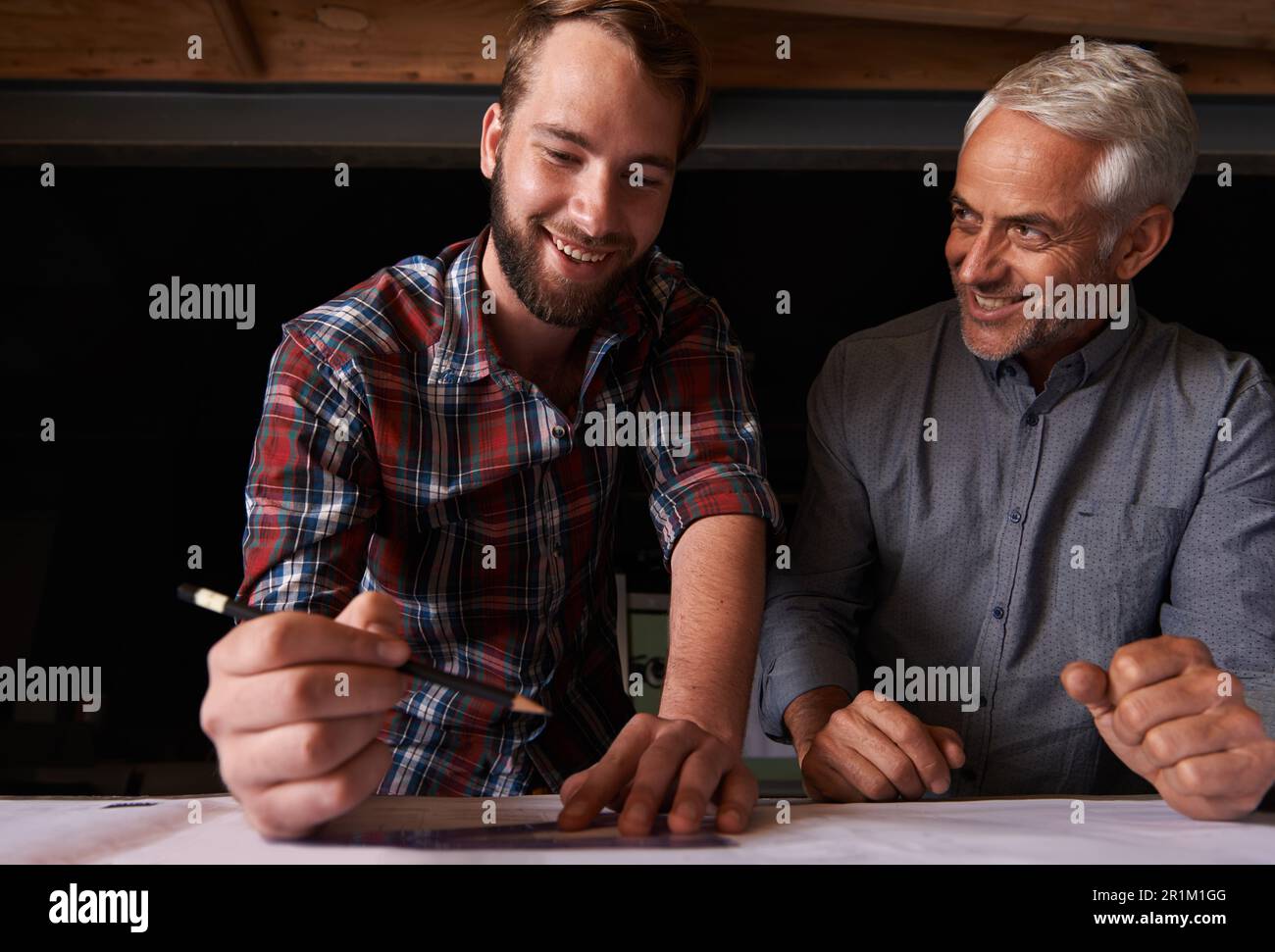 Turning his vision into reality. An architect drawing up plans Stock ...