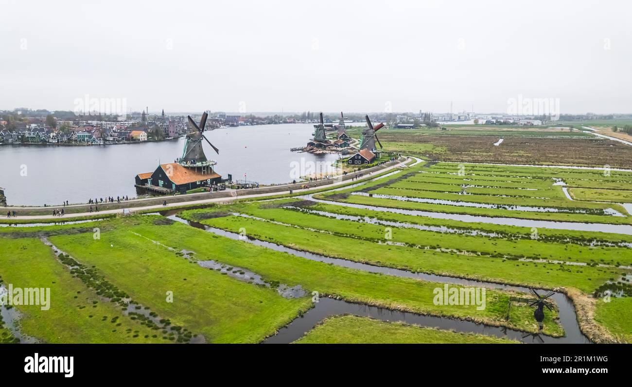 Panorama traditional Holland scenery of windmills and houses near the ...