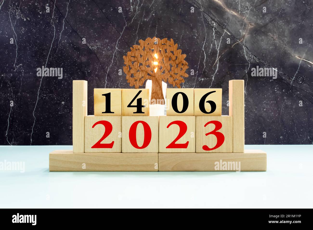 June 14th. June 14 wooden cube calendar with blur objects on background ...