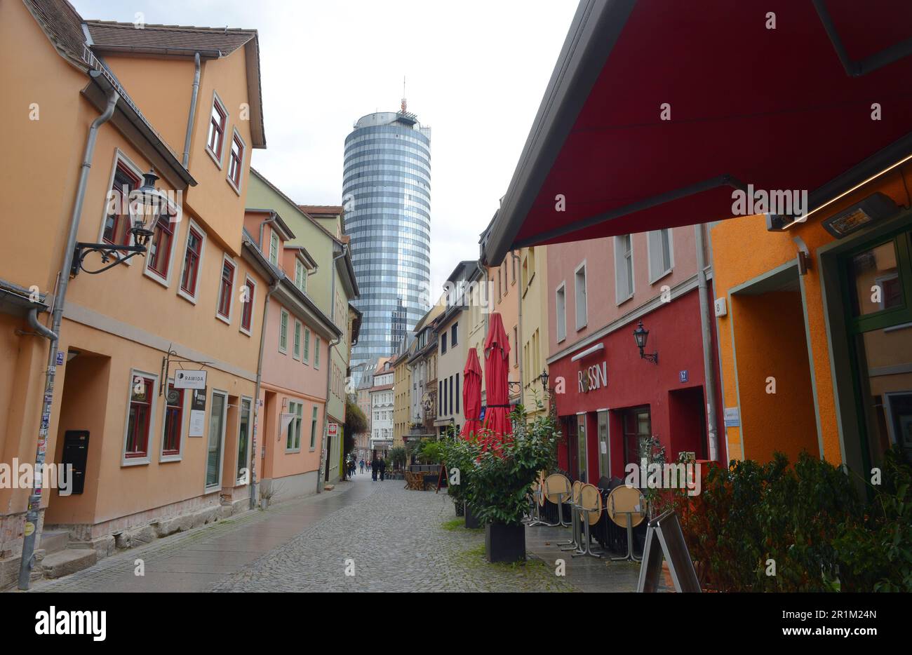 Jena, Germany, Wagnergasse restaurants and bars view to the high tower ...