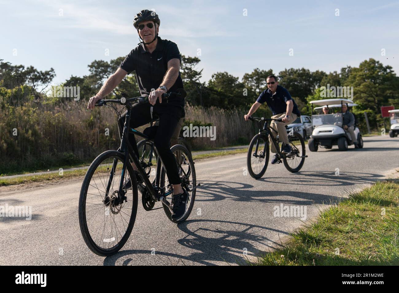 President Joe Biden goes on a bike ride in Gordons Pond State Park in ...