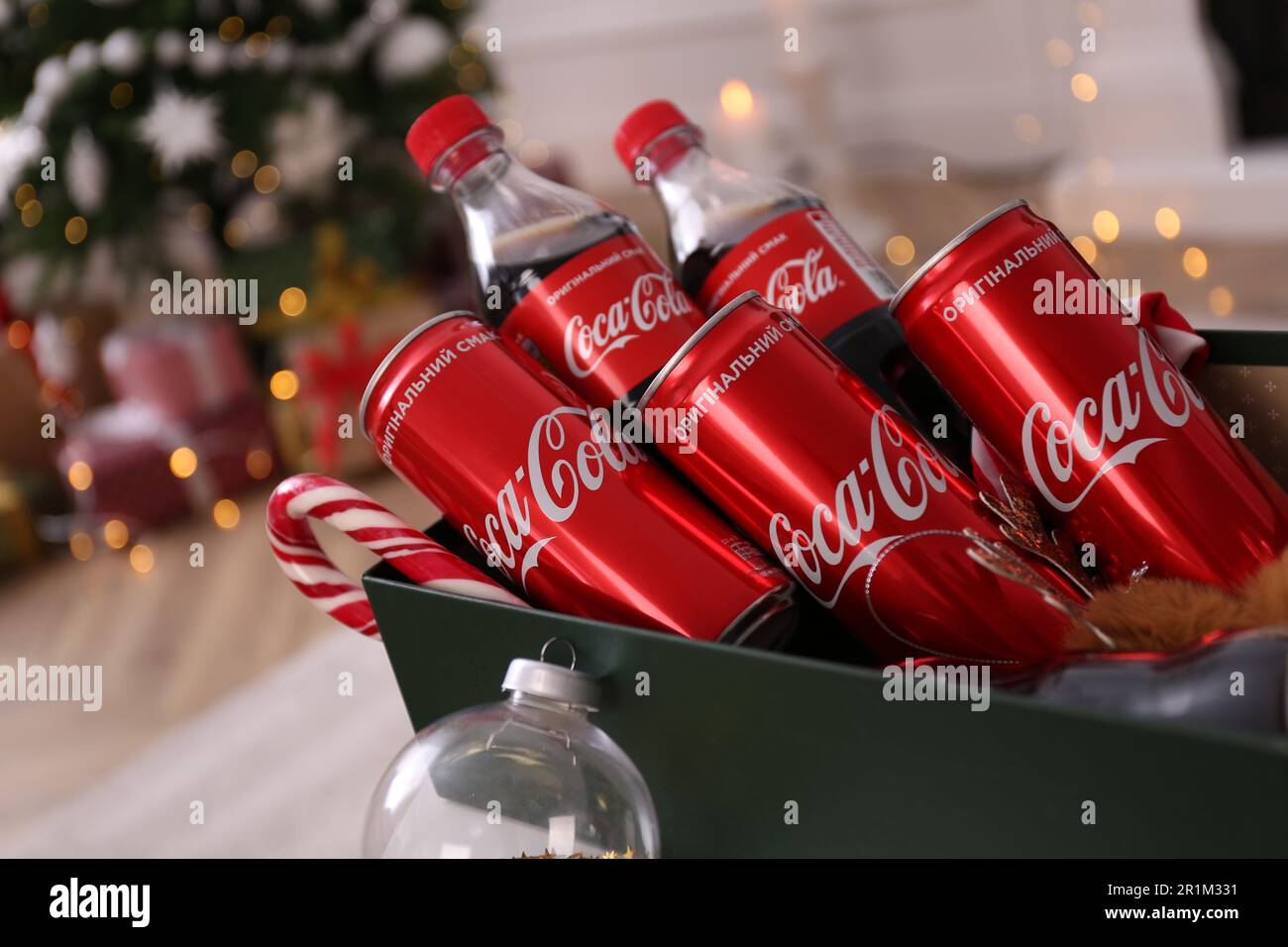 MYKOLAIV, UKRAINE - JANUARY 13, 2021: Coca-Cola bottles and cans in box ...