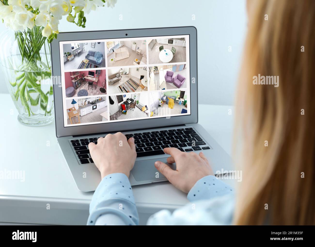 Woman monitoring CCTV cameras at table, closeup. Smart home security ...