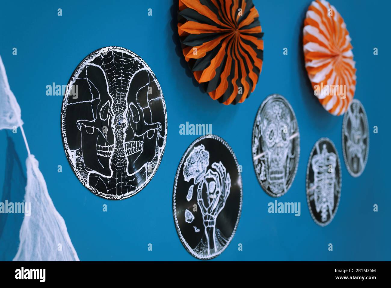 Different beautiful Halloween decorations on blue wall Stock Photo - Alamy