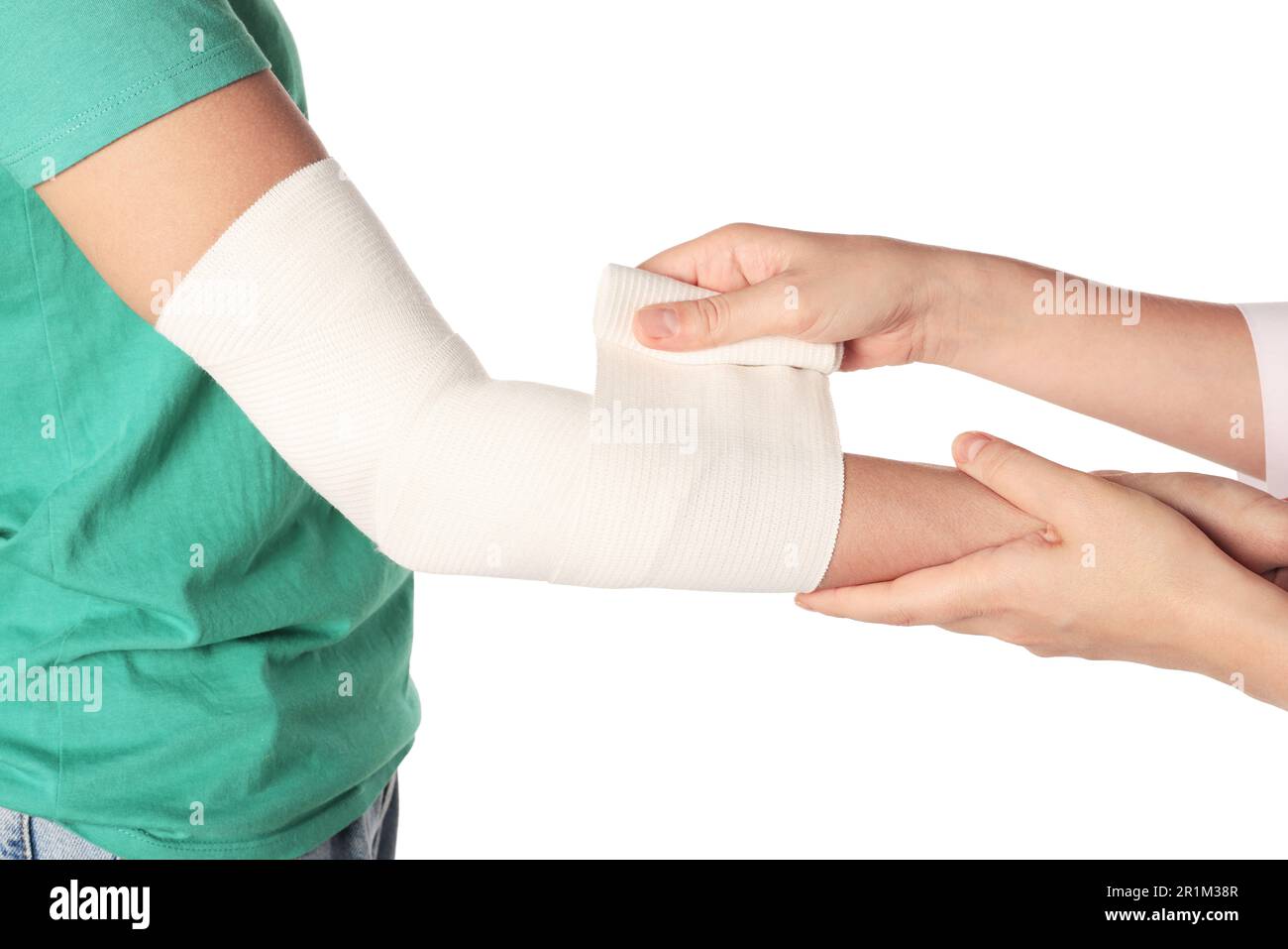 Doctor applying bandage onto patient's arm on white background, closeup ...
