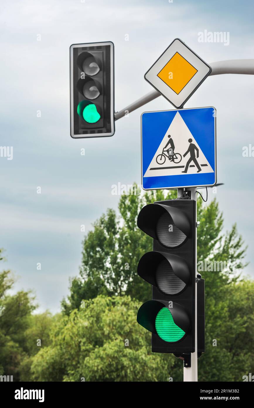 Traffic signs pedestrian crossing and priority road hi-res stock ...