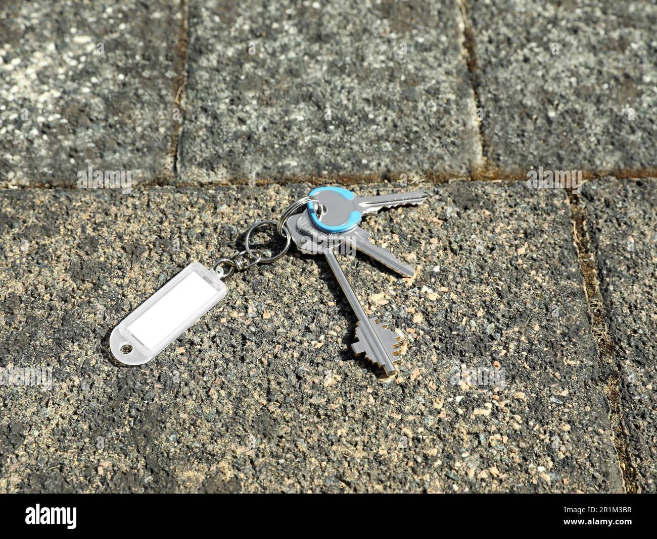 Bunch of lost keys on pavement outdoors Stock Photo - Alamy