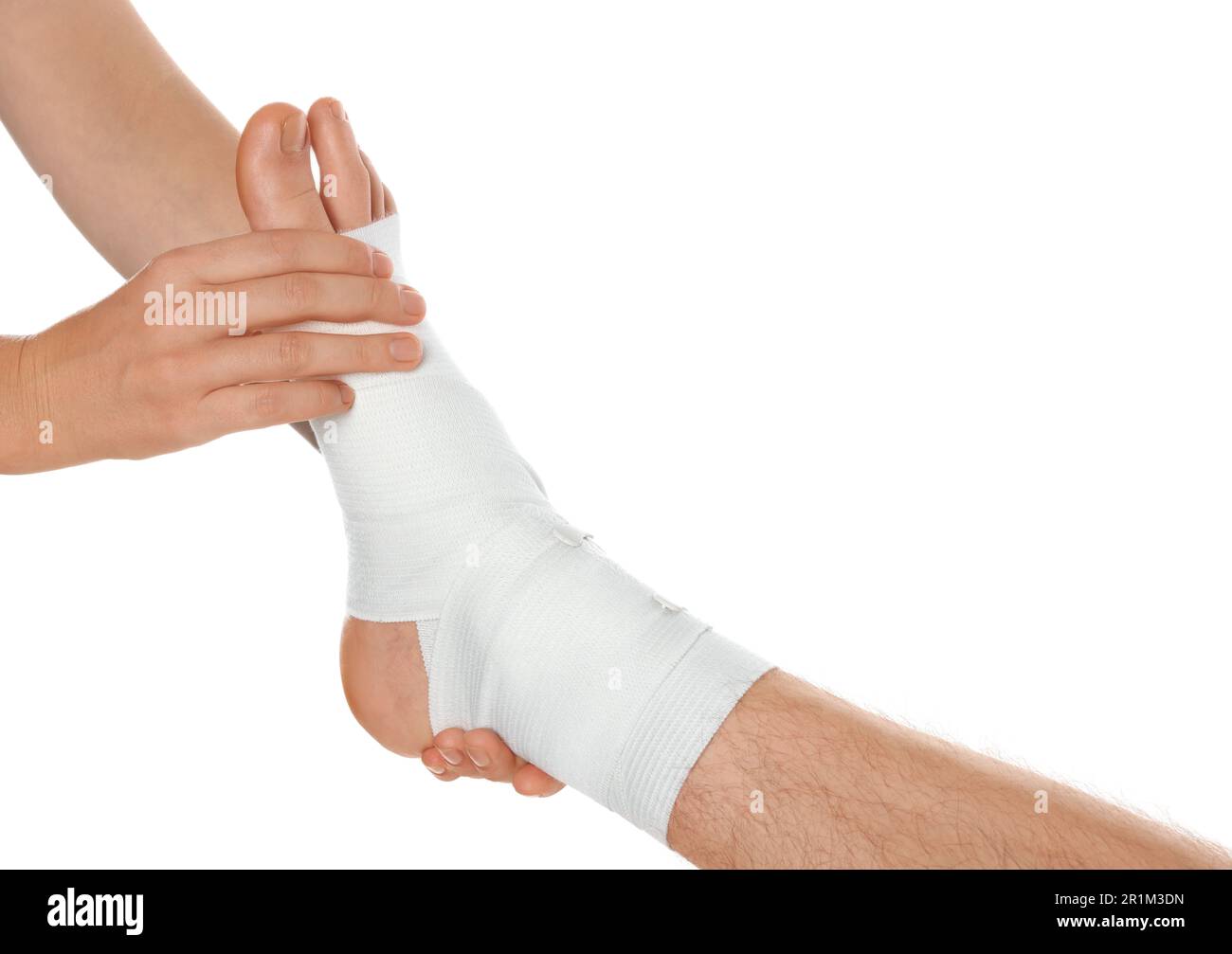 Doctor examining patient's foot wrapped in medical bandage on white ...