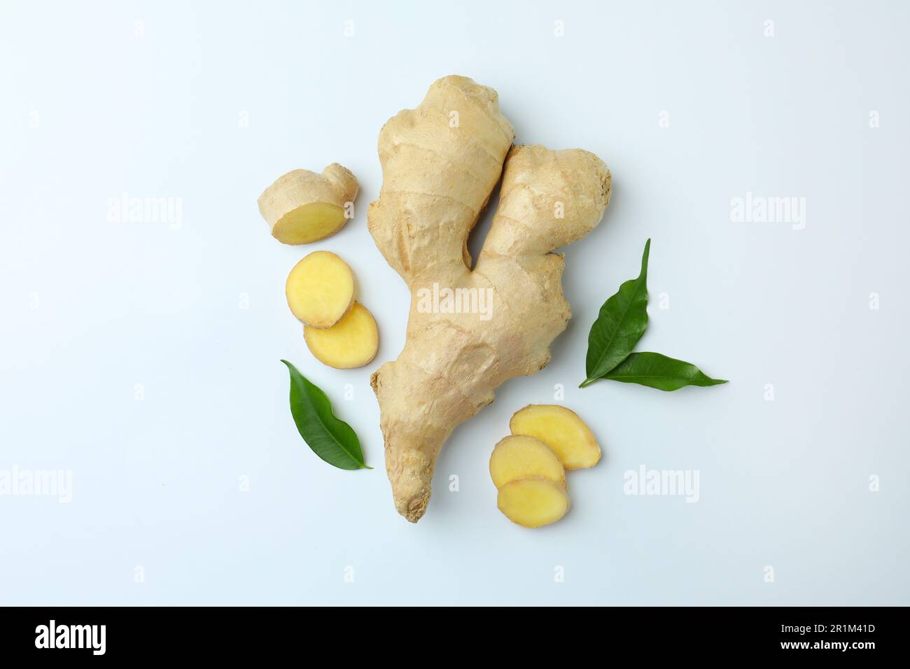 Fresh ginger with green leaves on white background, flat lay Stock ...