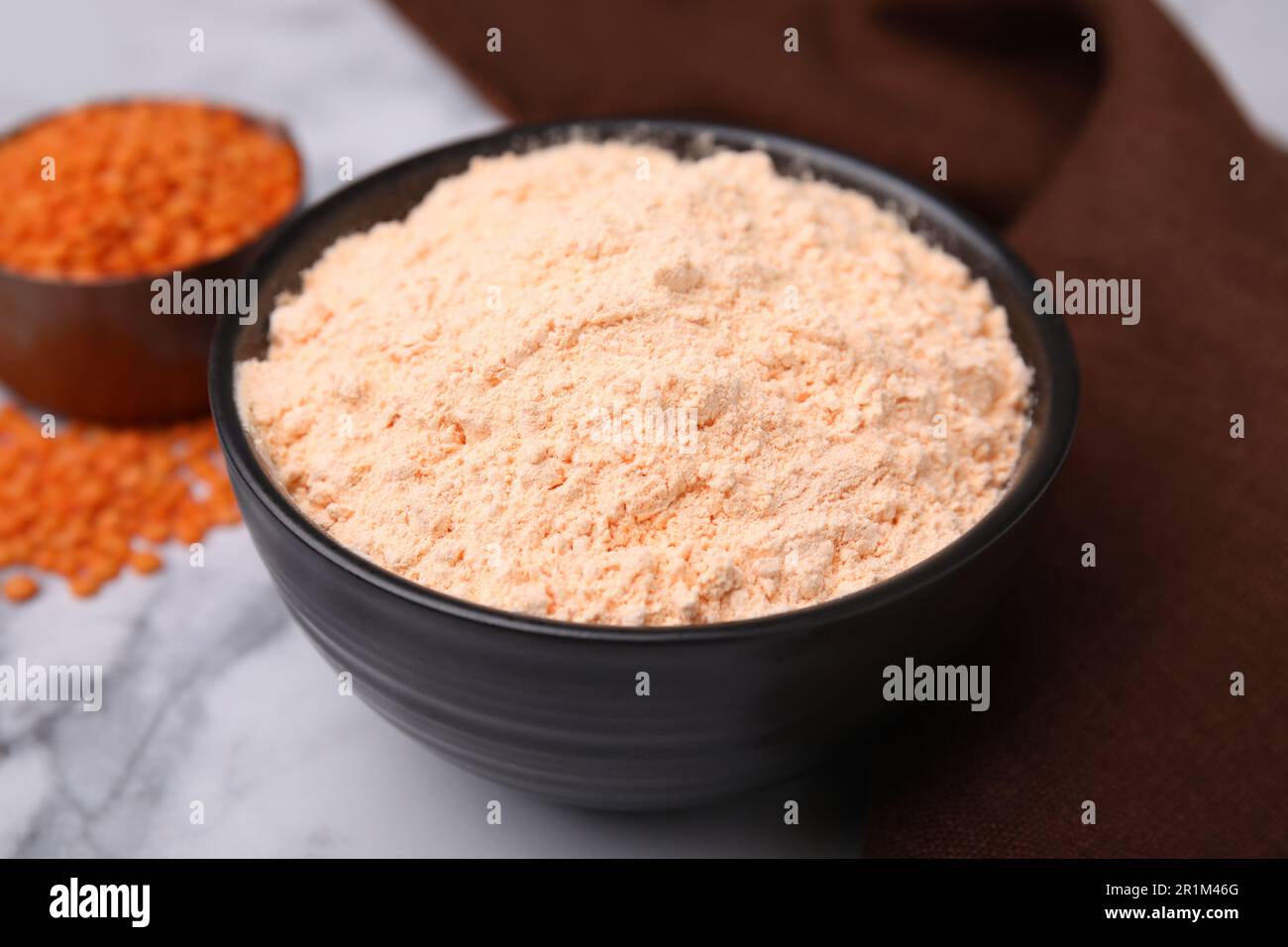 Lentil flour on white marble table, closeup Stock Photo - Alamy