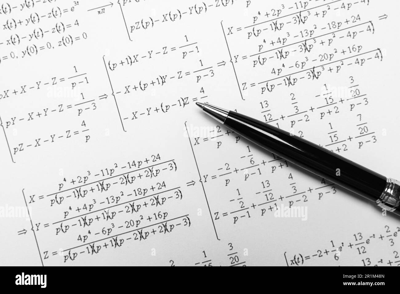 Sheet of paper with mathematical formulas and pen Stock Photo - Alamy
