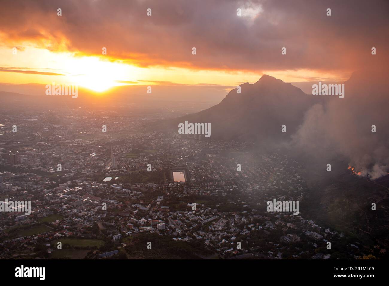 Controlled burn at the foot of Table Mountain at sunrise, Cape Town ...