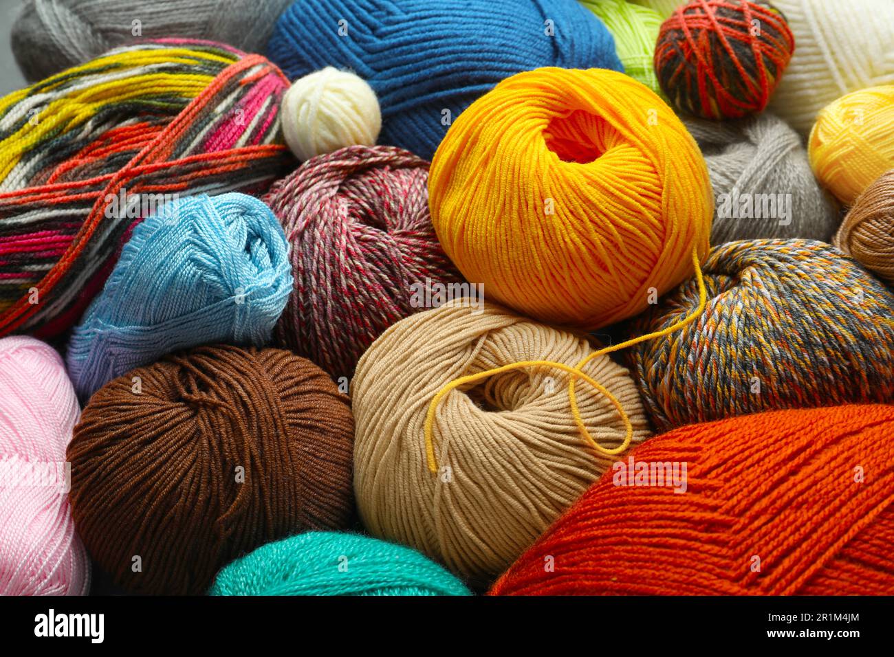 Different balls of woolen knitting yarns as background, closeup Stock ...